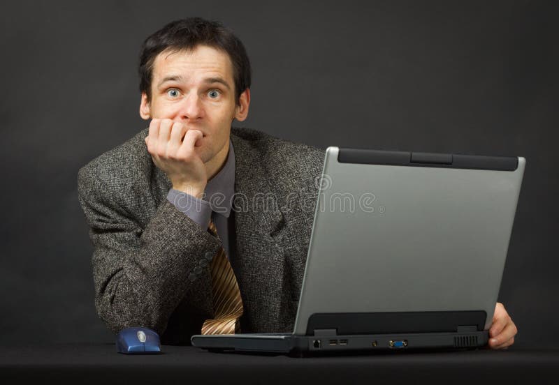 Surprised Person with Computer. Sits and Thinks. Stock Photo - Image of ...