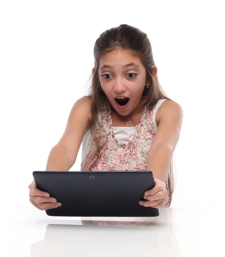 Surprised Pre-teen Girl with a Tablet Computer. Stock Photo - Image of ...