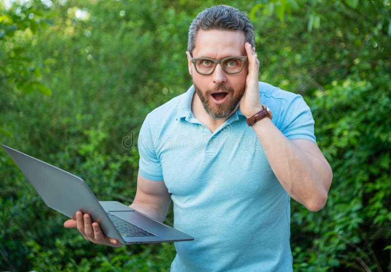 Surprised Programmer Man Working Online on Laptop. Photo of Programmer ...