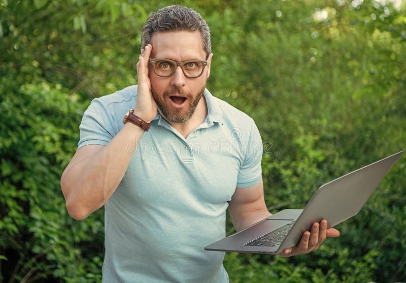Surprised Programmer Man Working Online on Laptop. Photo of Programmer ...