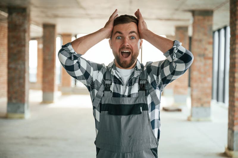 Surprised and Shocked. Construction Worker in Uniform in Empty ...