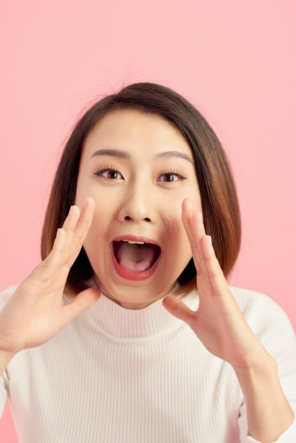 Surprised Shocked Excited Asian Woman Face Isolated on Pink Background ... Surprised Shocked Excited Asian Woman Face Isolated on Pink Background ...