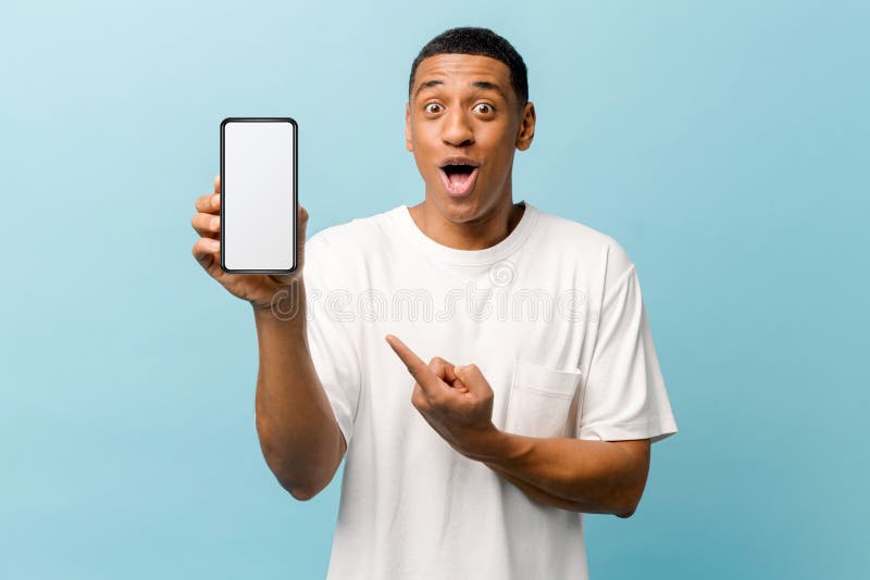 Surprised Smiling Man Freelancer Showing And Holding Smartphone With