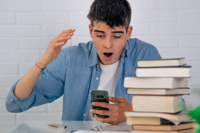 Surprised Student Looking at the Mobile Phone Stock Image - Image of ...