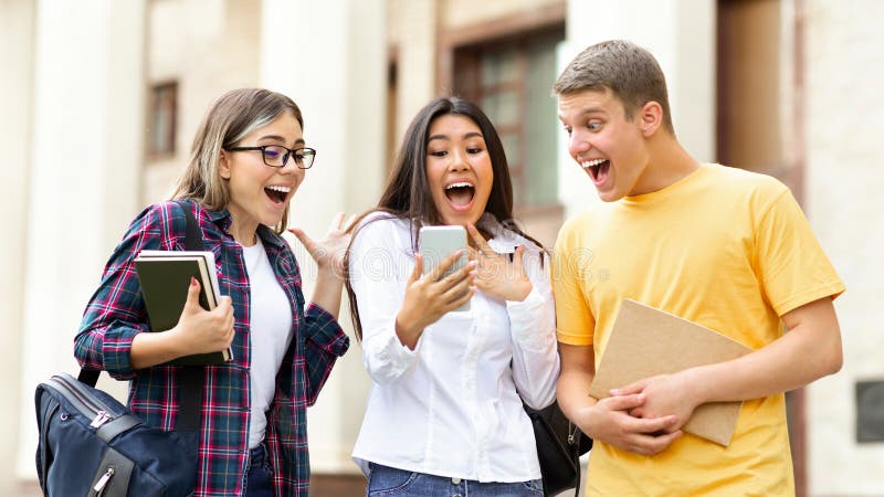Surprised Students Checking Exam Results on Smartphone Stock Photo ...