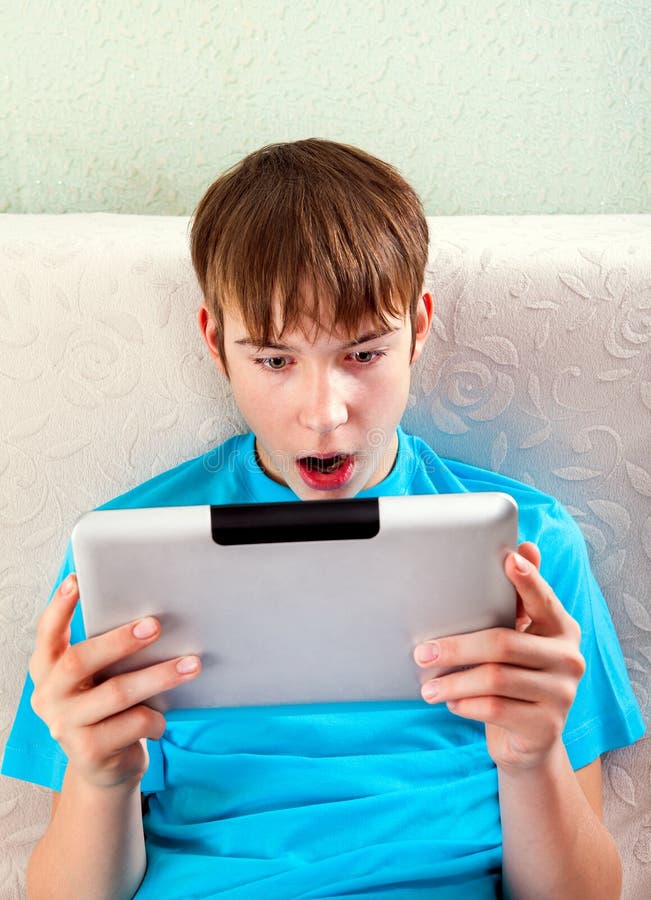 Surprised Teenager with a Tablet Stock Photo - Image of caucasian ...