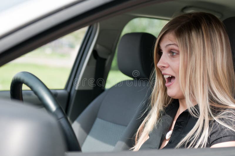 Shocked Woman Driving Car stock image. Image of adult - 76667469