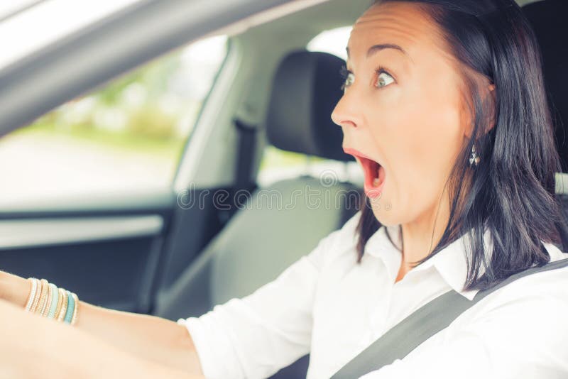 Surprised woman in the car stock photo. Image of motor - 61707658