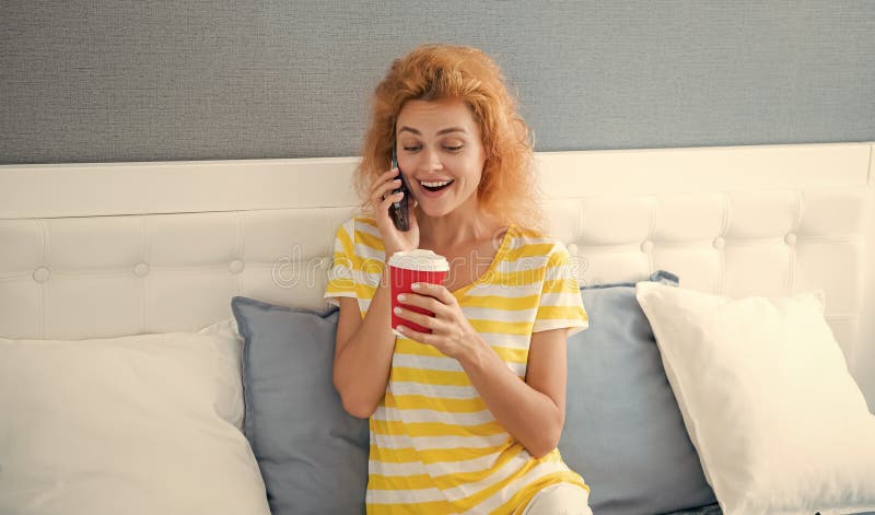 Surprised Woman with Coffee Talk on Phone. Woman at Home Talking on ...