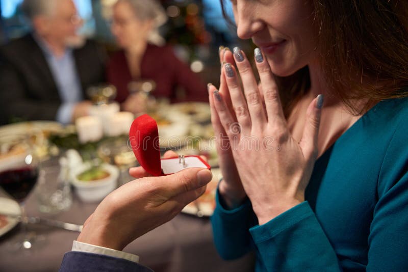Surprised Woman and Unrecognizable Man with Ring in Red Box Christmas ...