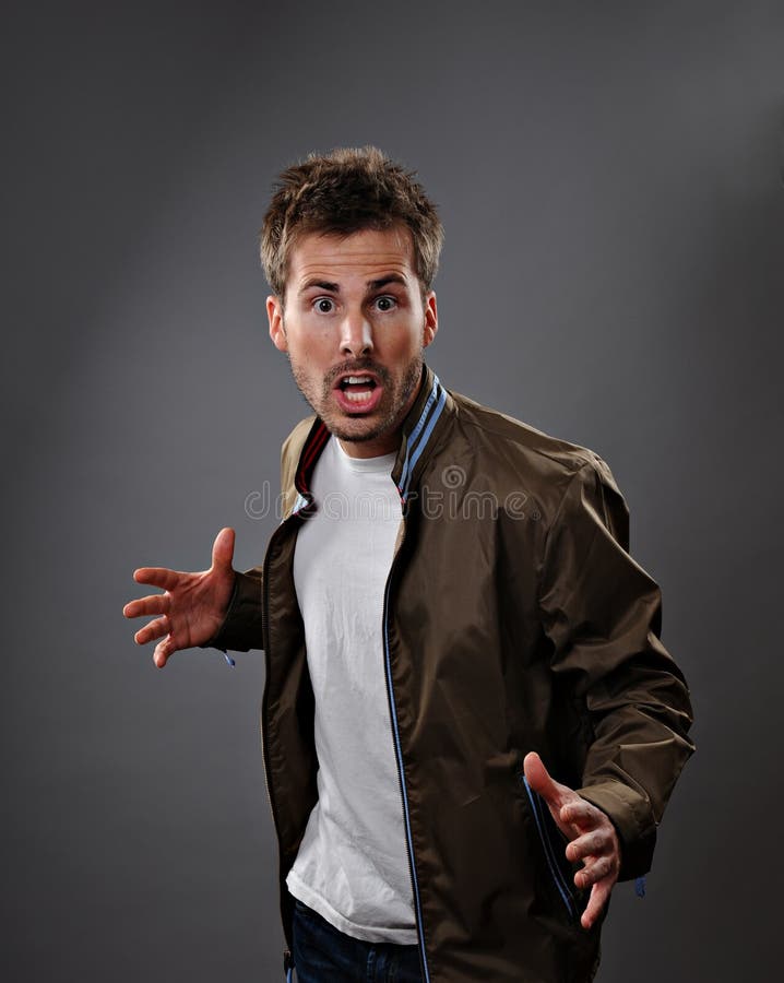 Surprised Young Man stock photo. Image of shot, blue - 21513362 Surprised Young Man stock photo. Image of shot, blue - 21513362