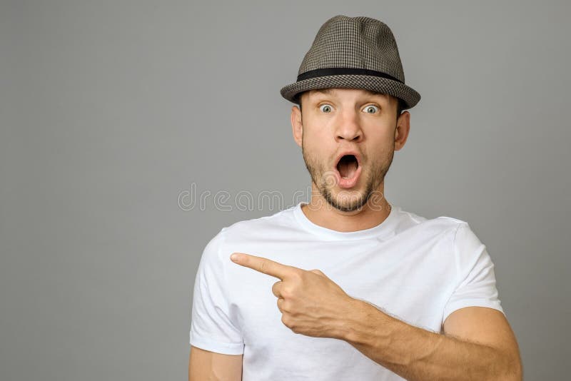 Surprised Young Man Pointing Copy Space Stock Photo - Image of casual ...