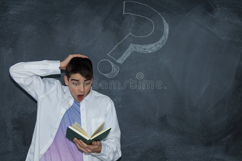 Surprised Young Man Reading the Book Stock Photo - Image of questioning ...