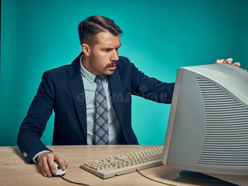 Surprised Young Man Working on Computer at Desk Stock Photo - Image of ...
