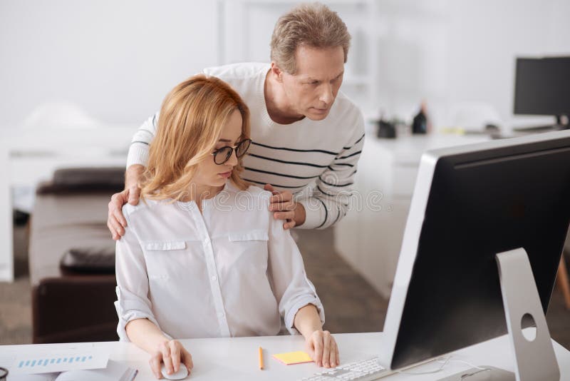 Surprised Young Secretary Collaborating with Boss at Work Stock Photo ...
