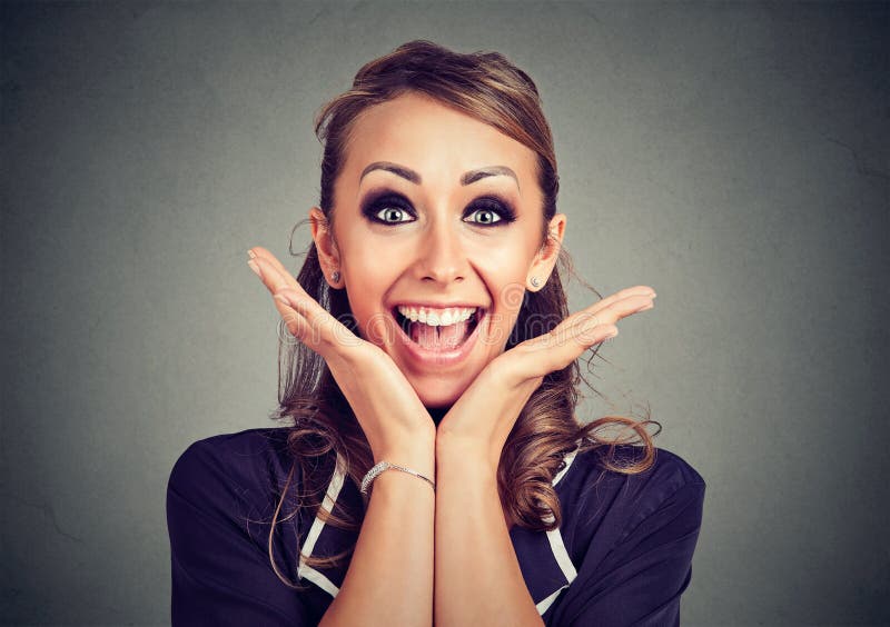 Portrait of a Surprised Young Woman Smiling in Studio Stock Image ...