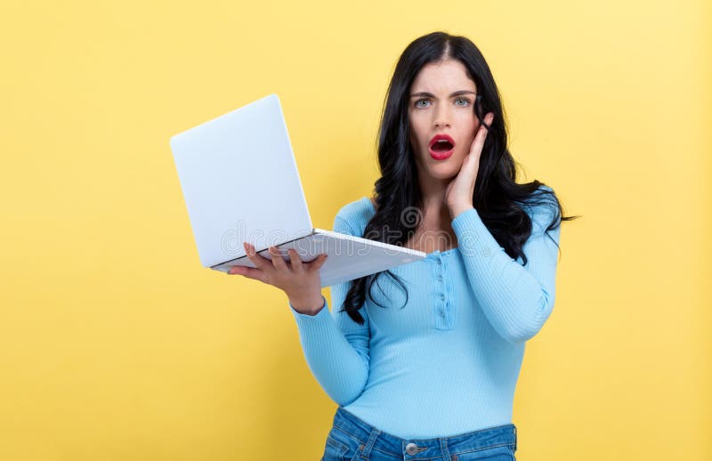 Surprised Young Woman Using a Laptop Computer Stock Image - Image of ...