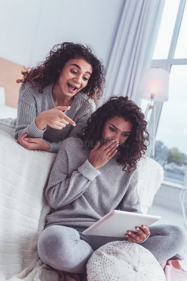 Two Friends Feeling Surprised after Reading Curious Beauty Article ...