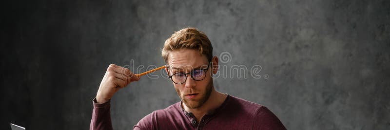 The Surprising Man Wrinkling His Forehead and Reading Documents in the ...