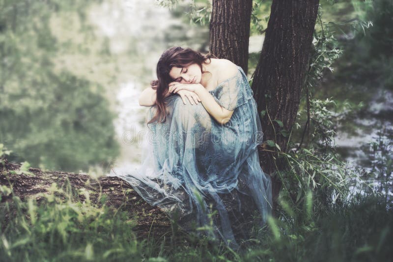 Surreal Elegant and Romantic Girl, Sleeping Crouched in a Tree Stock ...