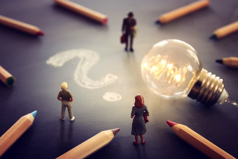 Surreal Image of People Looking at Glowing Light Bulbs. Concept of ...