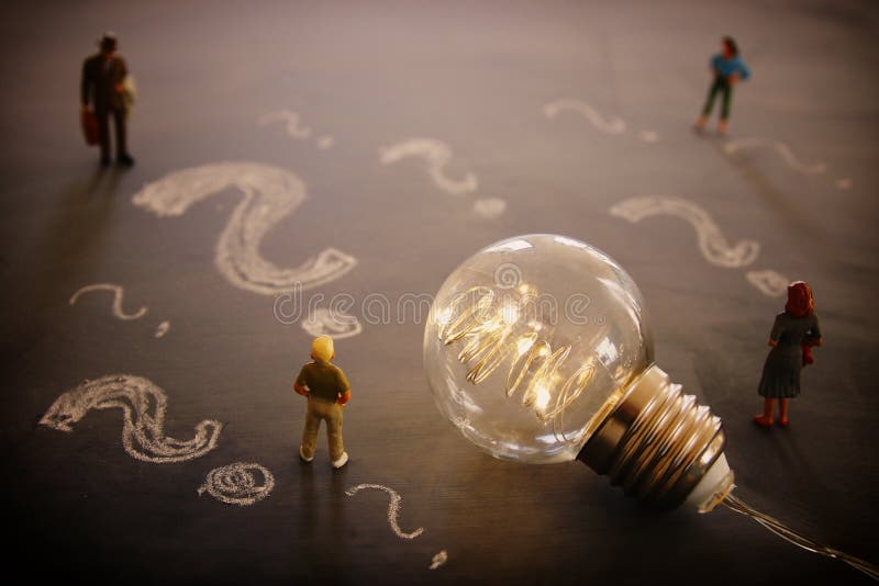 Surreal Image of People Looking at Glowing Light Bulbs. Concept of ...