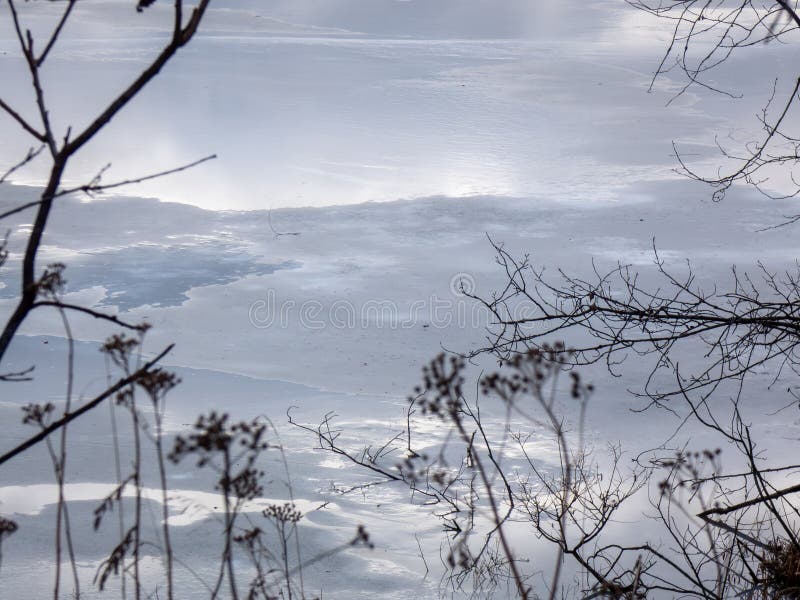 A Surreal Scene of Ice, Snow, and Reflections of Sky on Water. Stock ...