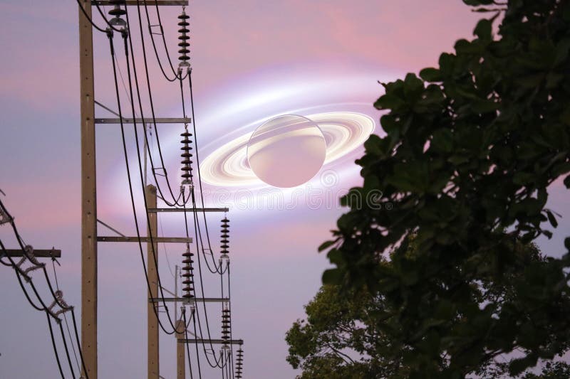 Surreal Scene of Saturn Over Power Lines at Sunset Sky Stock ...