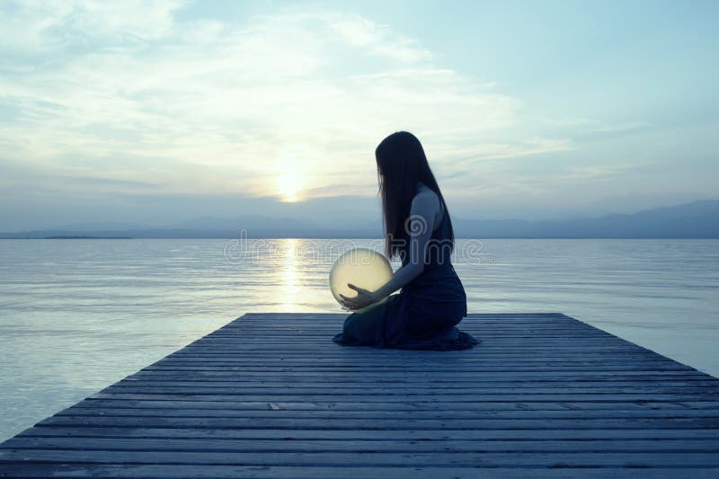 Surreal Scene of a Woman with a Light Sphere in Front of the Setting ...