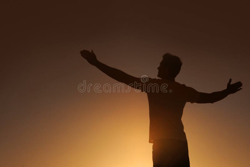 Surrendering To a Higher Power. Silhouette of a Man with His Arms ...