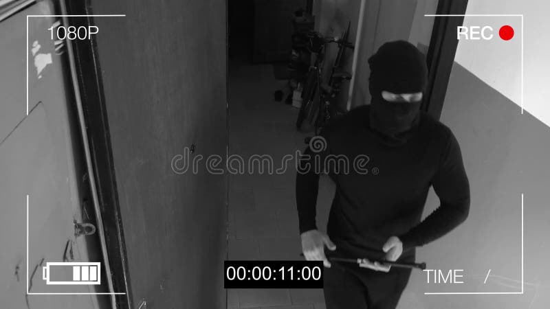 Surveillance Camera Caught the Robber in a Mask with a Crowbar Stock ...