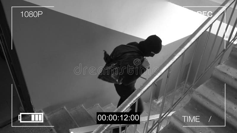 Surveillance Camera Caught the Robber in a Mask Running Off with a Bag ...