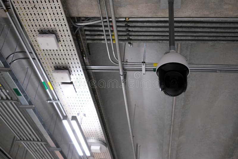 Surveillance Camera Hanging on Concrete Ceiling. Stock Photo - Image of ...