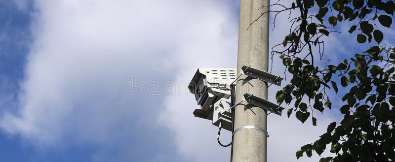 Surveillance Camera Installed on a Utility Pole Against a Backdrop of ...