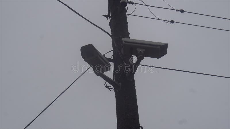 Surveillance Camera on a Lamp Post on Blue Sky Background. CCTV Stock ...