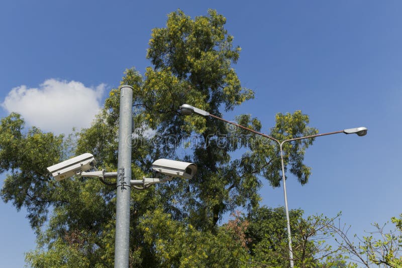 Surveillance Camera and Lamp Post in the Park. Stock Photo - Image of ...