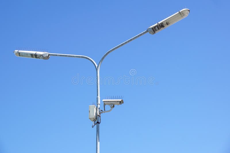 Surveillance Camera on Light Pole in Parking Lot Stock Image - Image of ...