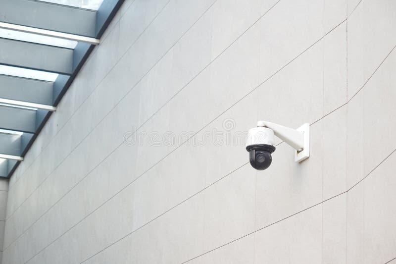 Surveillance Camera Mounted on a Building Wall with Glass Roof Stock ...