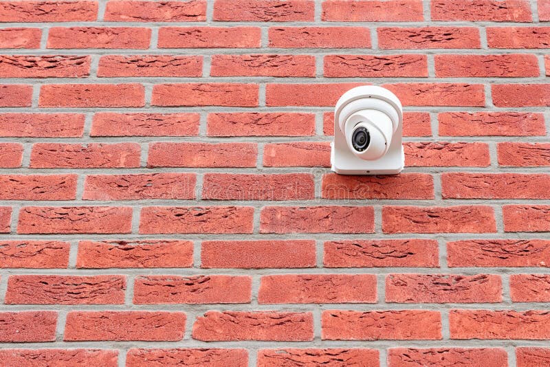 Surveillance Camera Mounted on Red Brick Wall Stock Photo - Image of ...