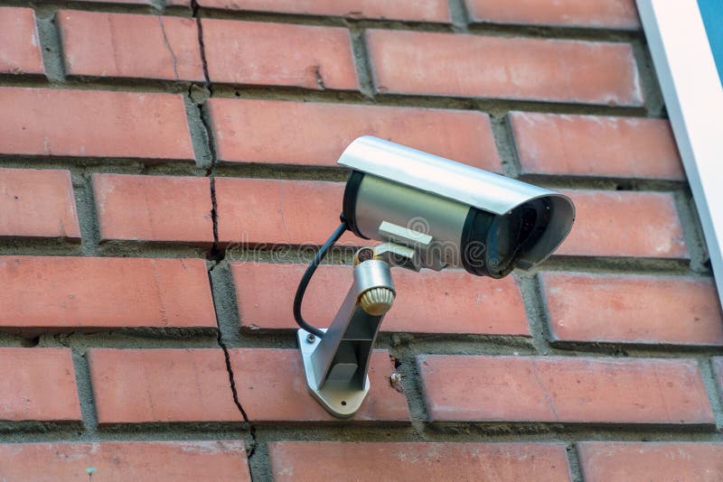 Surveillance Camera on a Red Brick Wall Stock Image - Image of ...