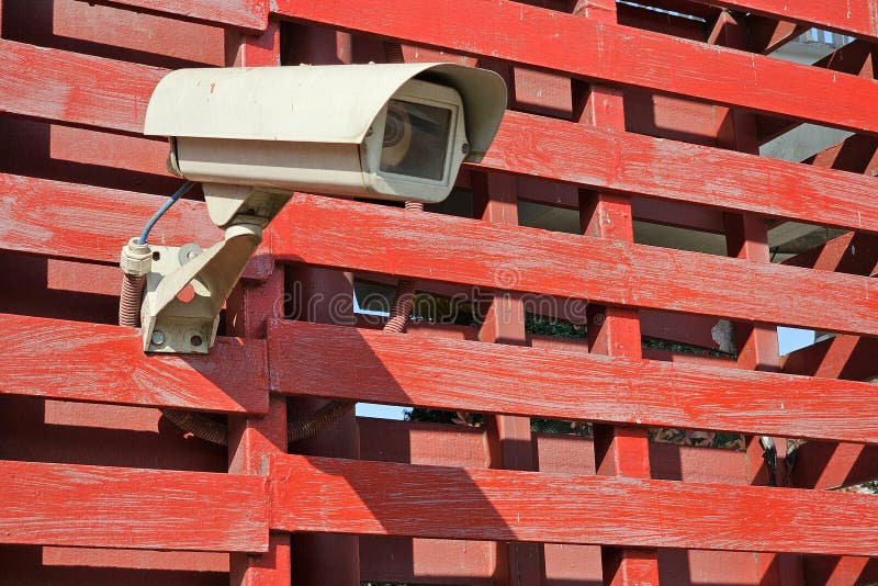 Surveillance Camera on Red Wooden Fence. Stock Photo - Image of safety ...