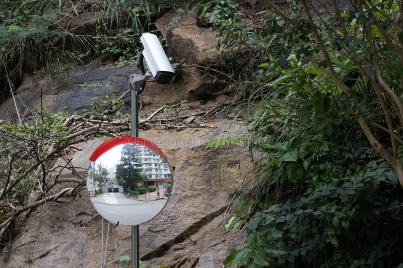 The Surveillance Camera beside the Rock Stock Image - Image of ...