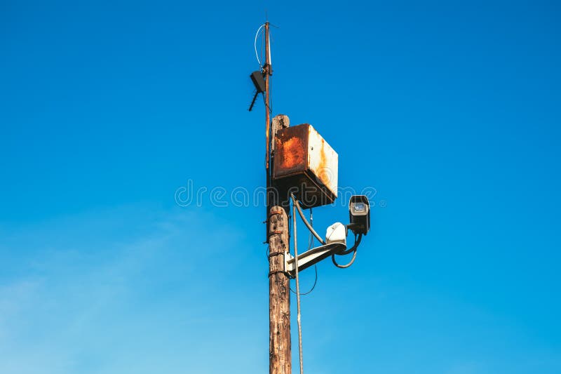 Surveillance Camera and Rusty Corroded Control Box on Wooden Post at ...