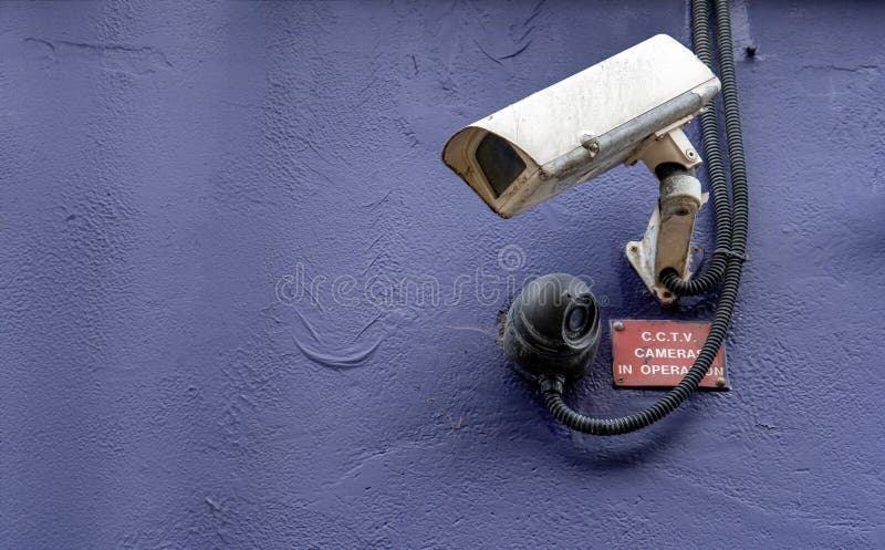 Surveillance Camera on the Textured Wall Stock Photo - Image of ...