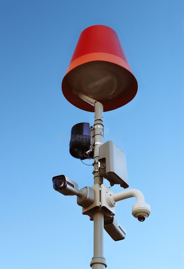 Surveillance System with an Orange Warning Light Located on a Pole in ...
