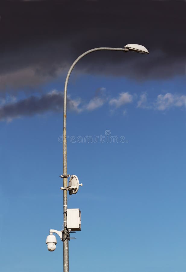 Surveillance System with an Orange Warning Light Located on a Pole in ...