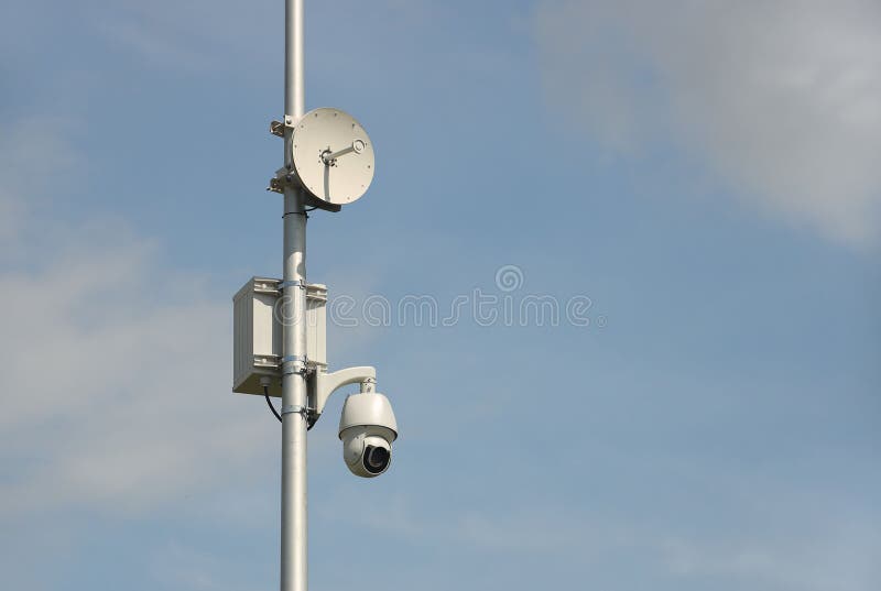 Surveillance System with an Orange Warning Light Located on a Pole in ...