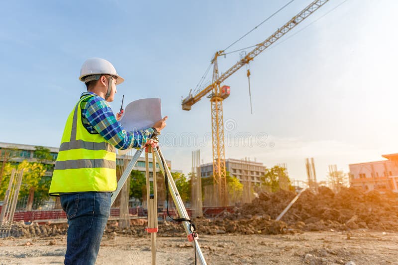 Surveying Engineers are Working Together Using Theodolite on the ...