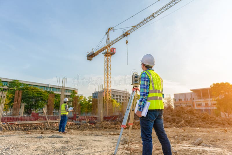 Surveying Engineers are Working Together Using Theodolite on the ...