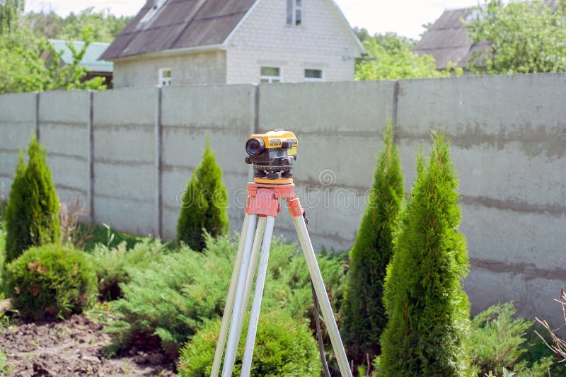 Surveying Measuring Equipment Level Transit on Tripod at Construction ...